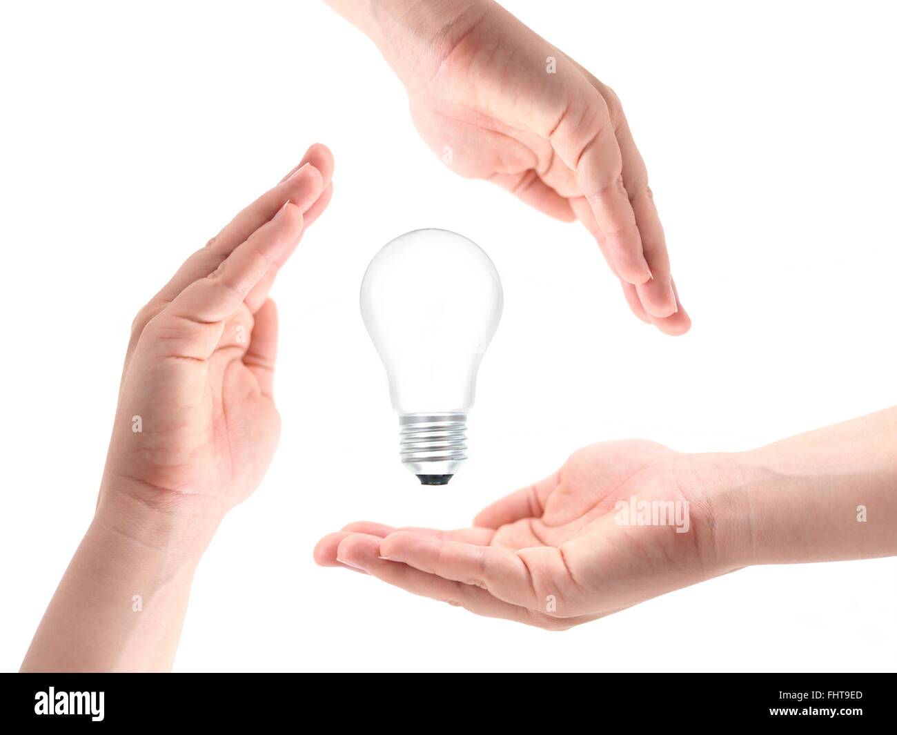 Female hands protecting a clear light bulb Stock Photo - Alamy