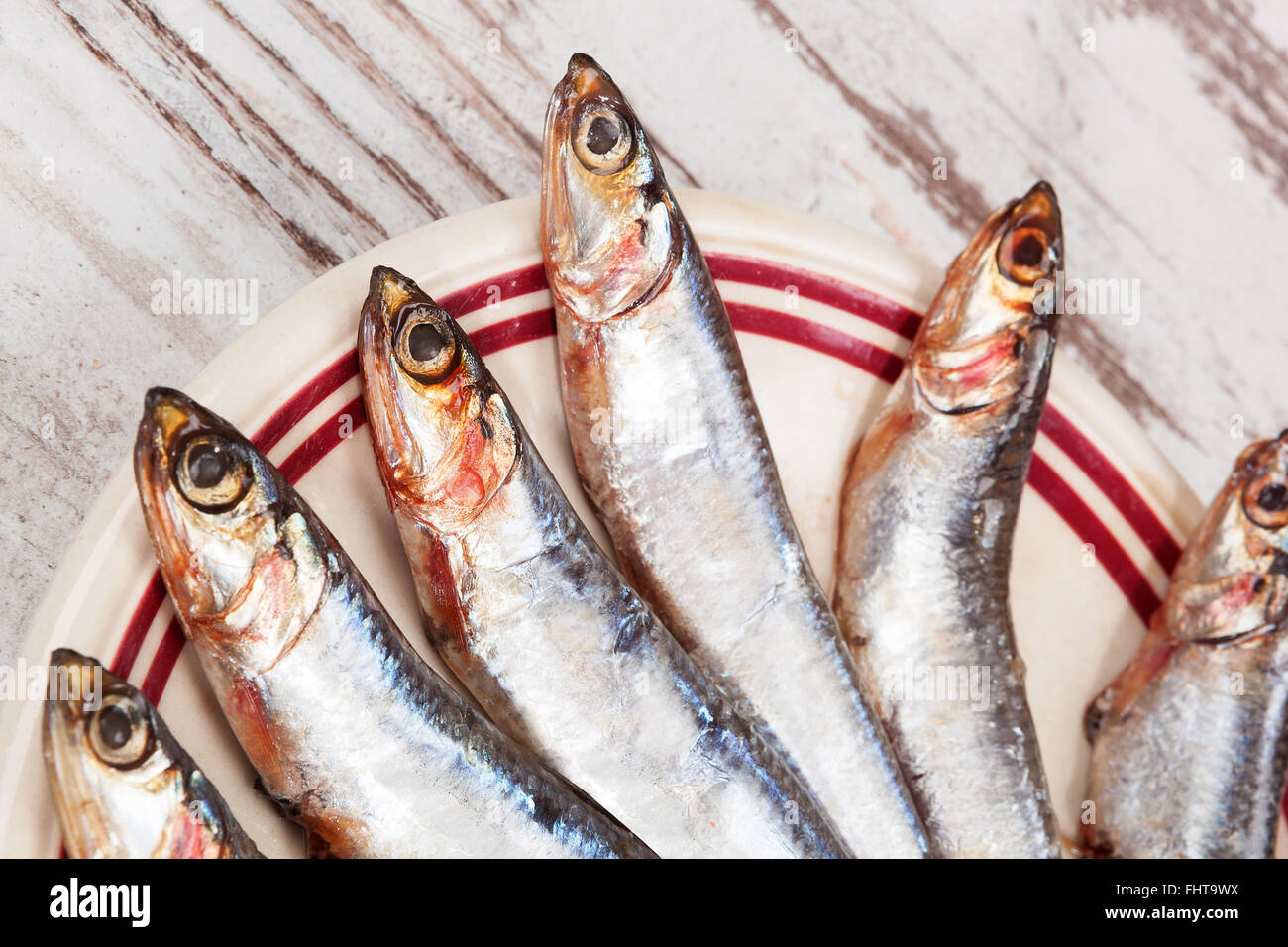 Several sardines on plate, top view Stock Photo - Alamy