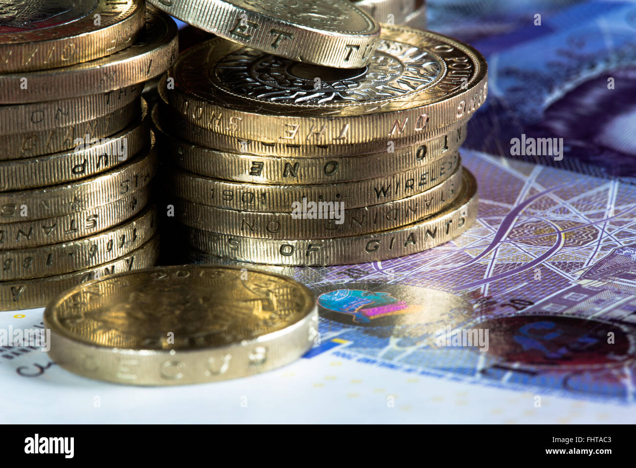 A macro image of coins and notes of the British Realm. Specifically Two ...