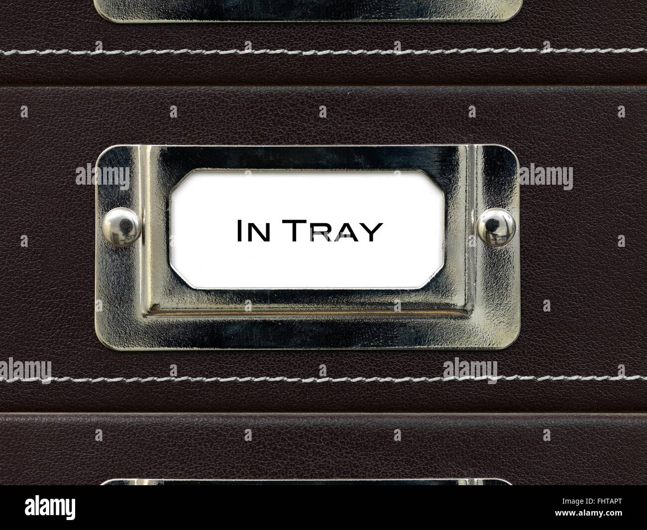 An office tray label on a leather tray Stock Photo - Alamy