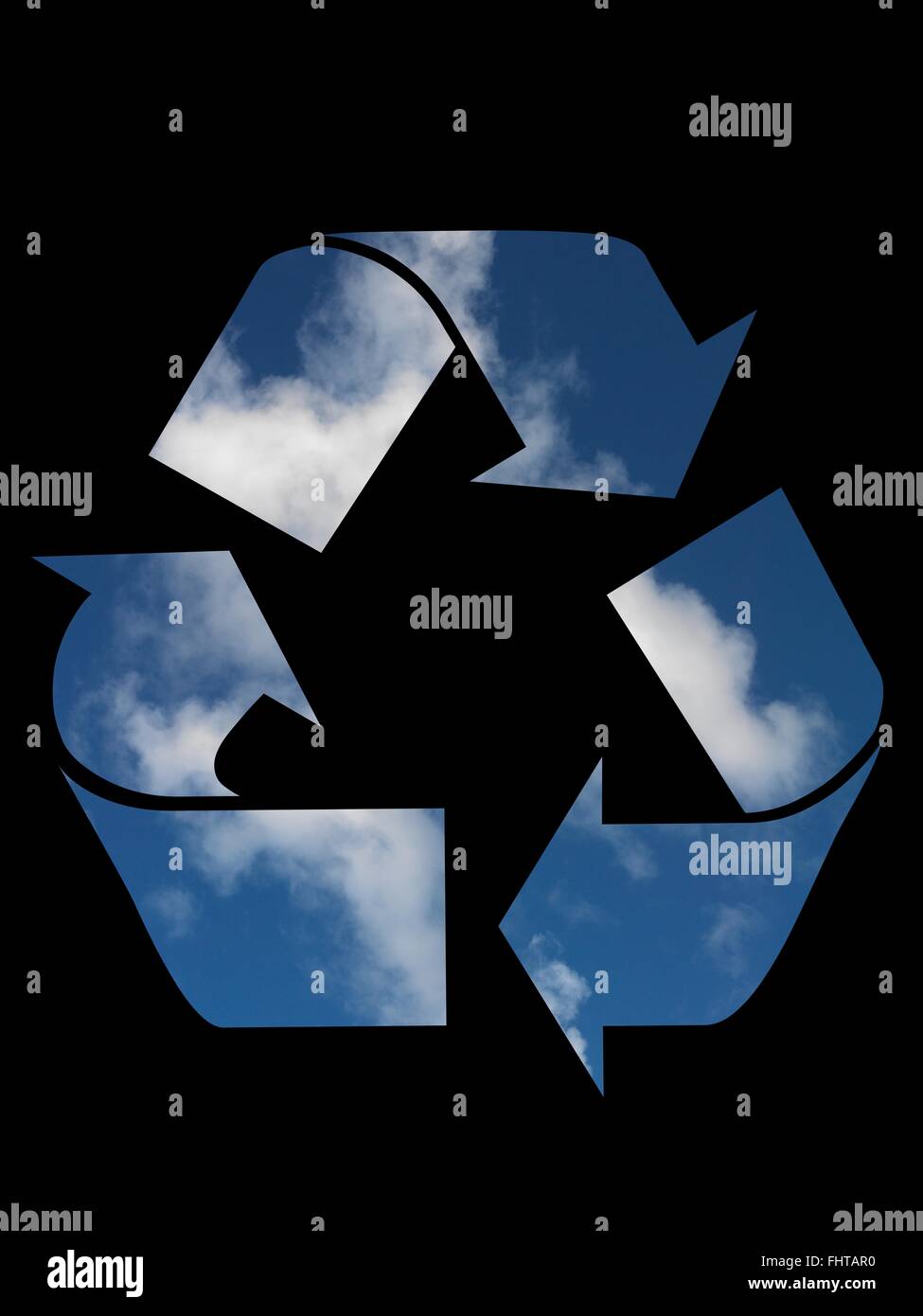 A recycle symbol cutout on a blue sky Stock Photo - Alamy