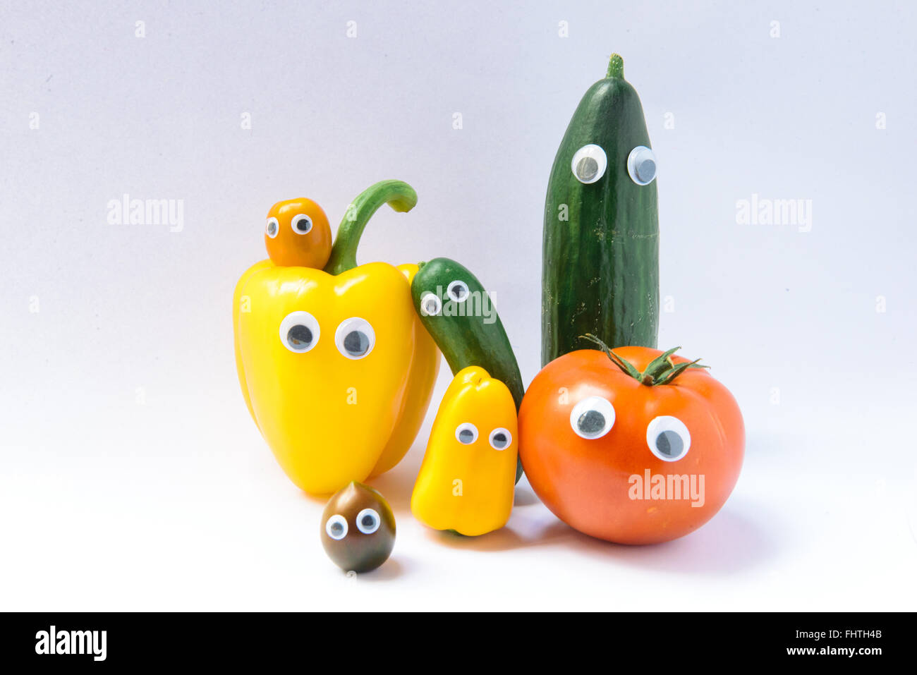 A family of vegetables with eyes Stock Photo - Alamy