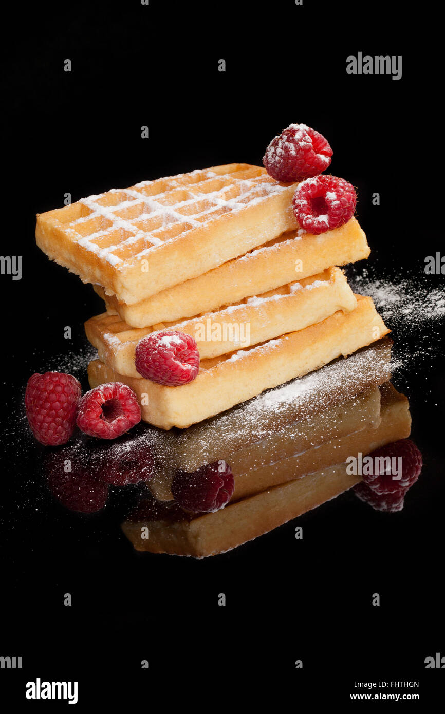 Waffles with raspberries isolated Stock Photo - Alamy