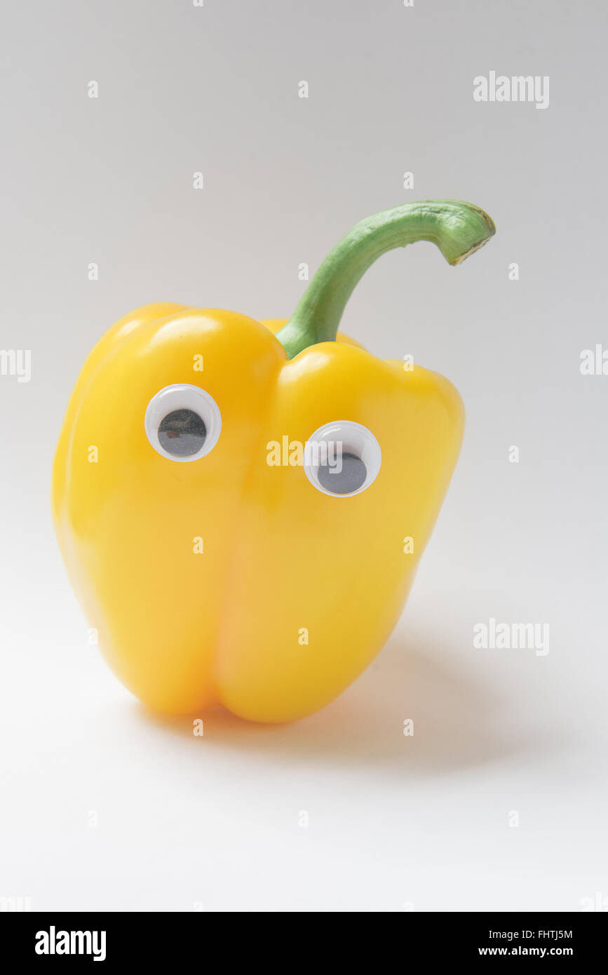 A yellow pepper with eyes Stock Photo - Alamy