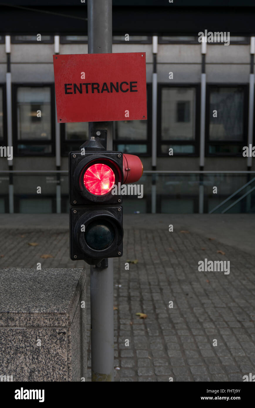 Red light prohibiting entrance into a building Stock Photo - Alamy