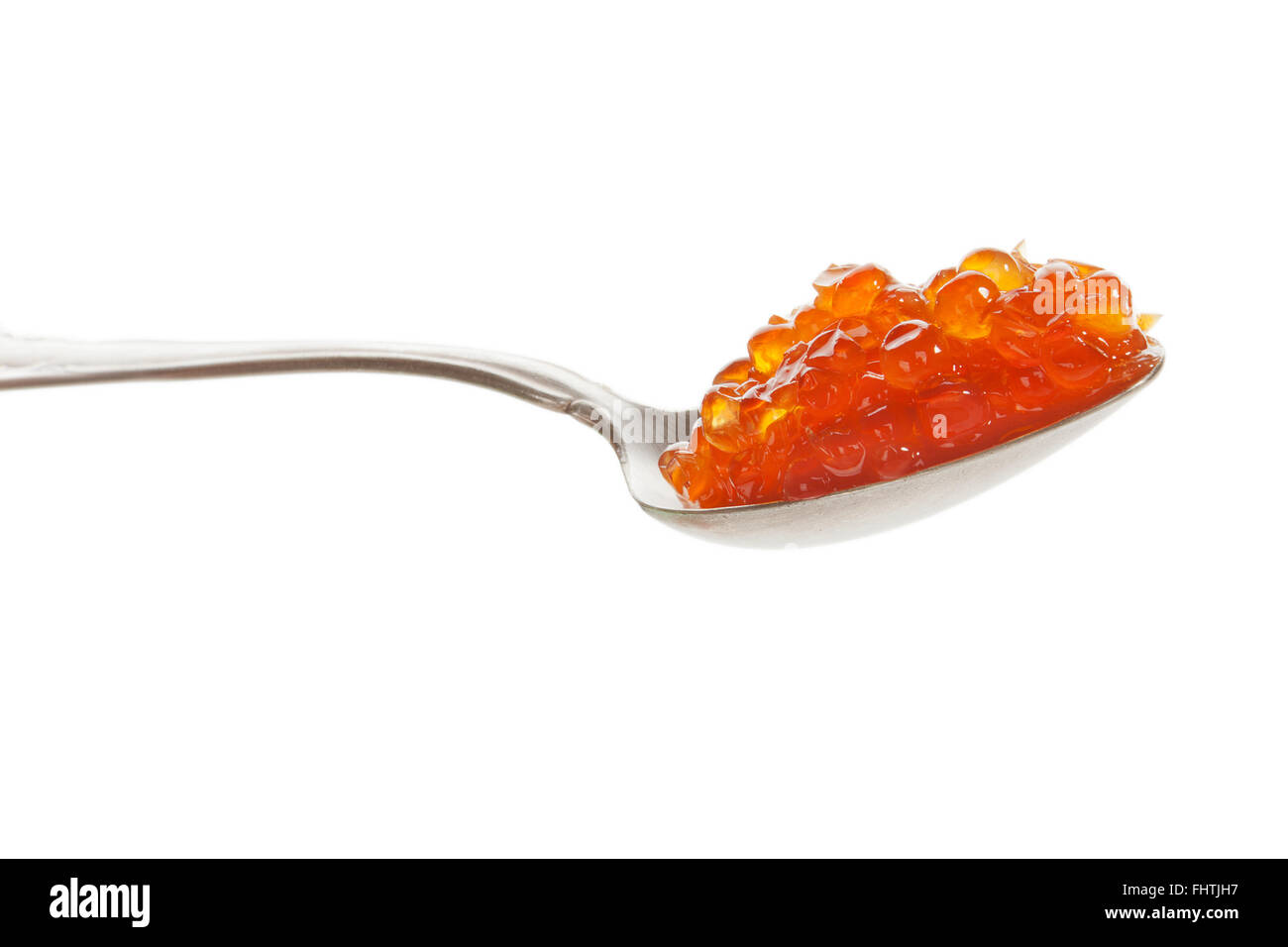Caviar on antique silver spoon isolated Stock Photo - Alamy