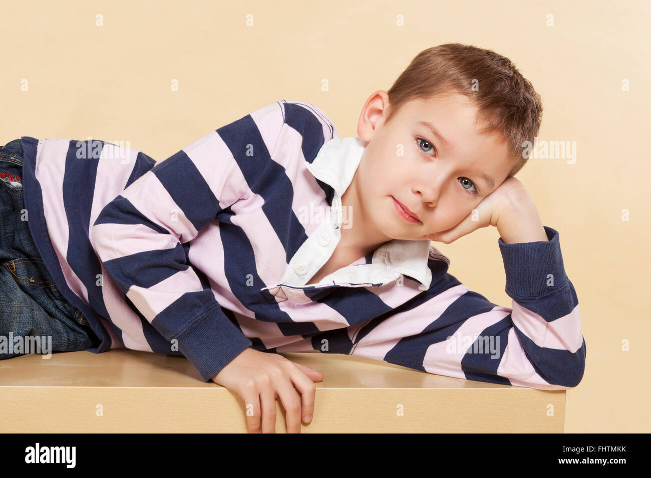 Boy looking into camera Stock Photo - Alamy