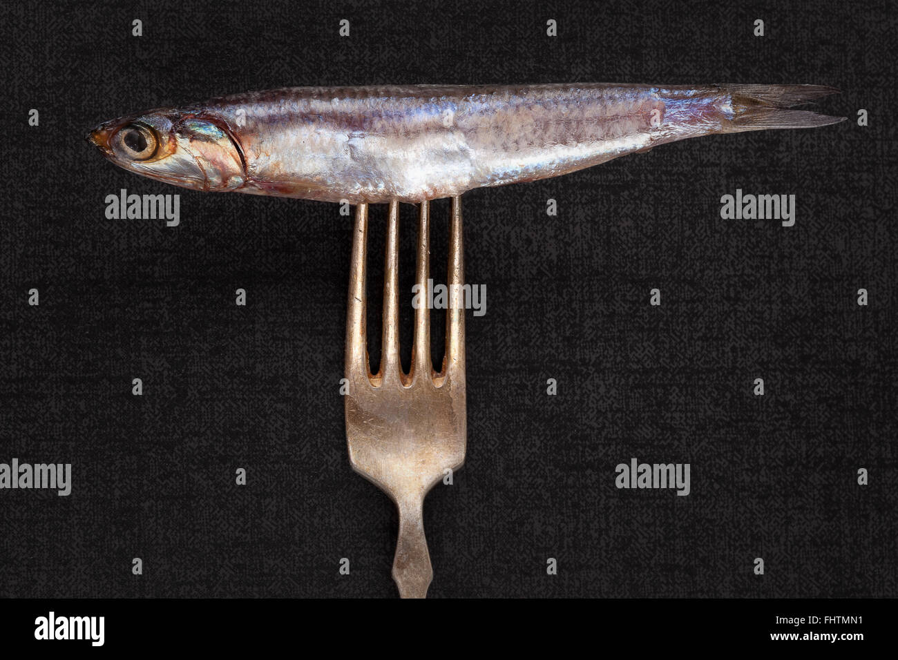 Fish on fork, luxurious seafood background Stock Photo - Alamy