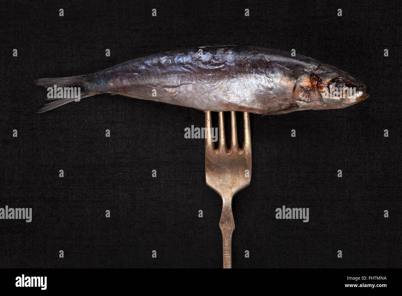 Fish on fork Stock Photo - Alamy