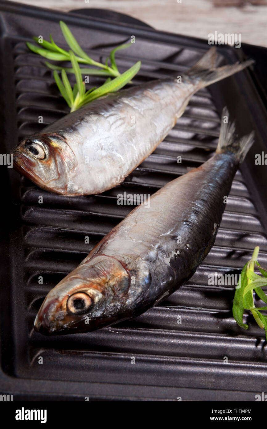Fresh fish on roast Stock Photo - Alamy