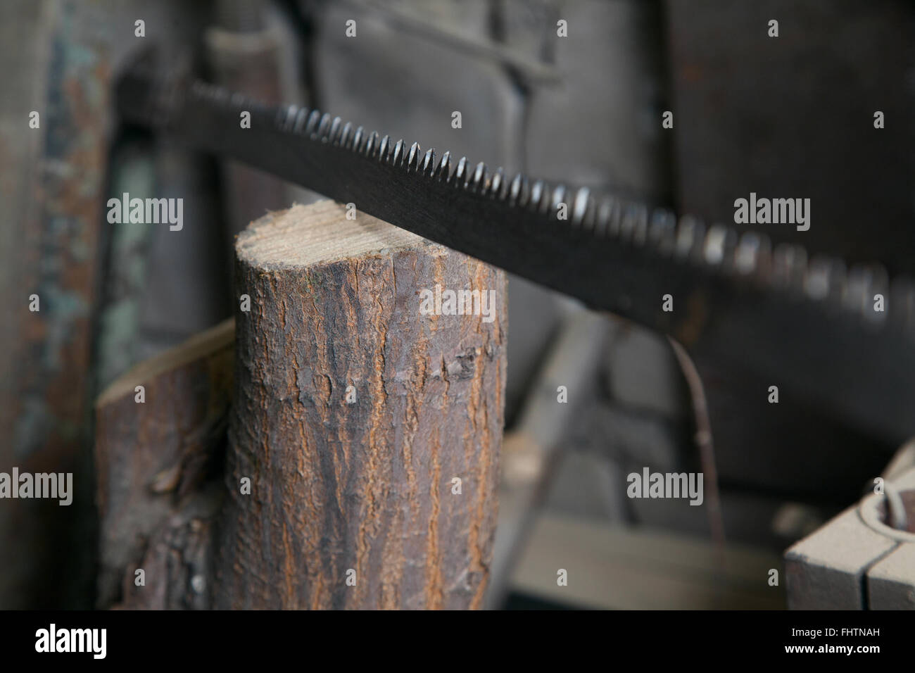 Old rusty saw on wooden background Stock Photo - Alamy