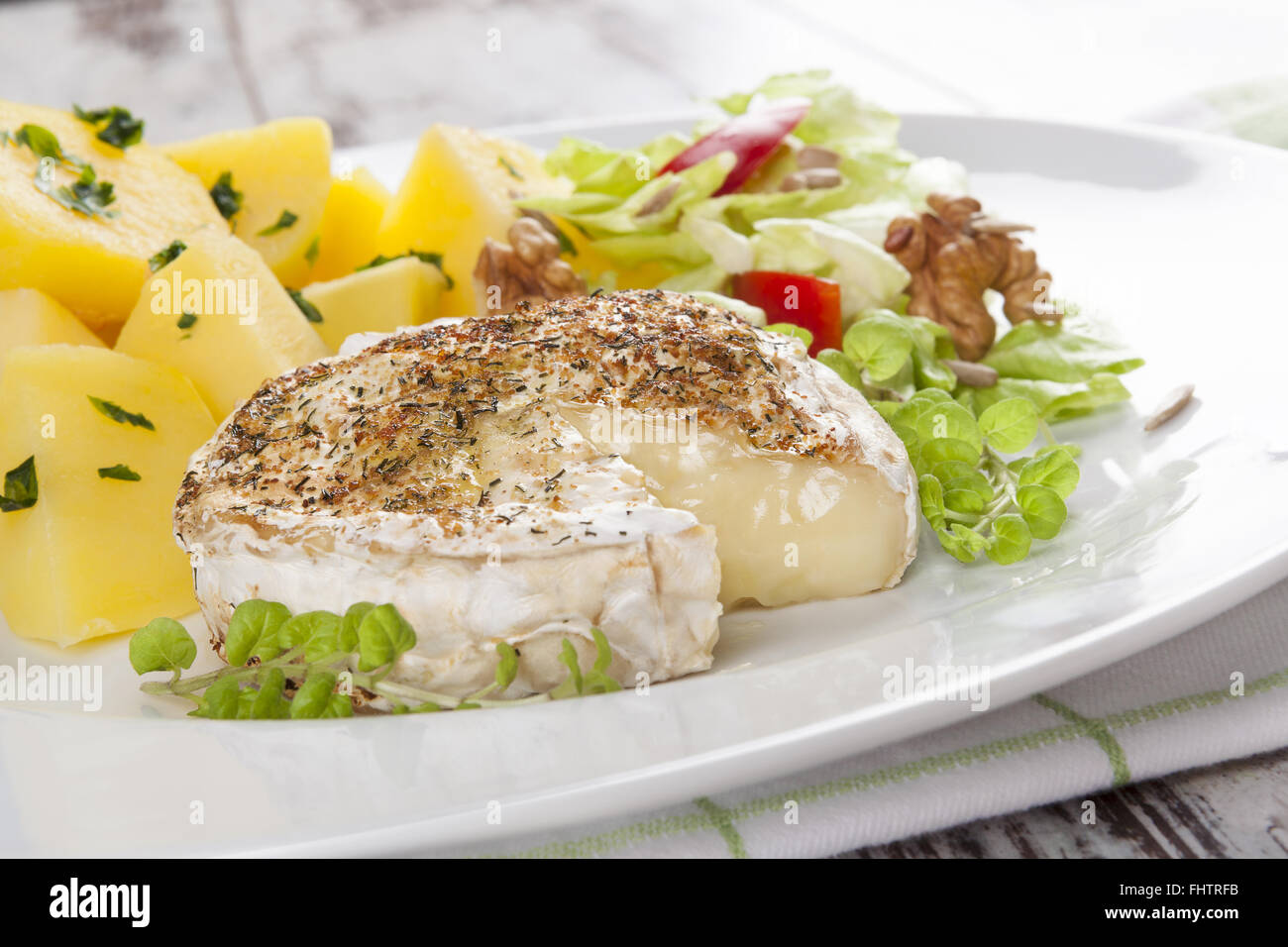 Baked melted camembert cheese Stock Photo - Alamy