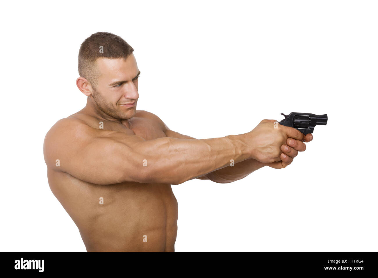 Muscular caucasian man with gun Stock Photo - Alamy