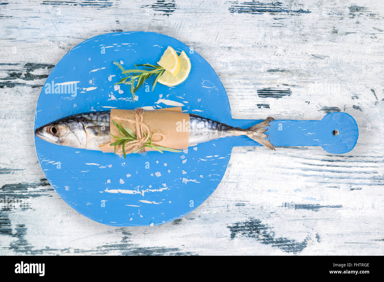Fresh mackerel fish in white and blue Stock Photo - Alamy