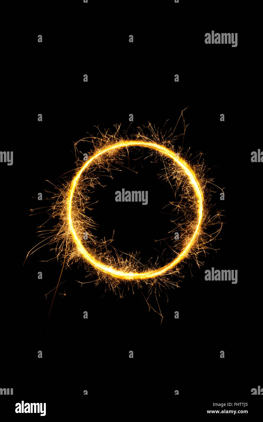 Sparkling circle isolated on black Stock Photo - Alamy