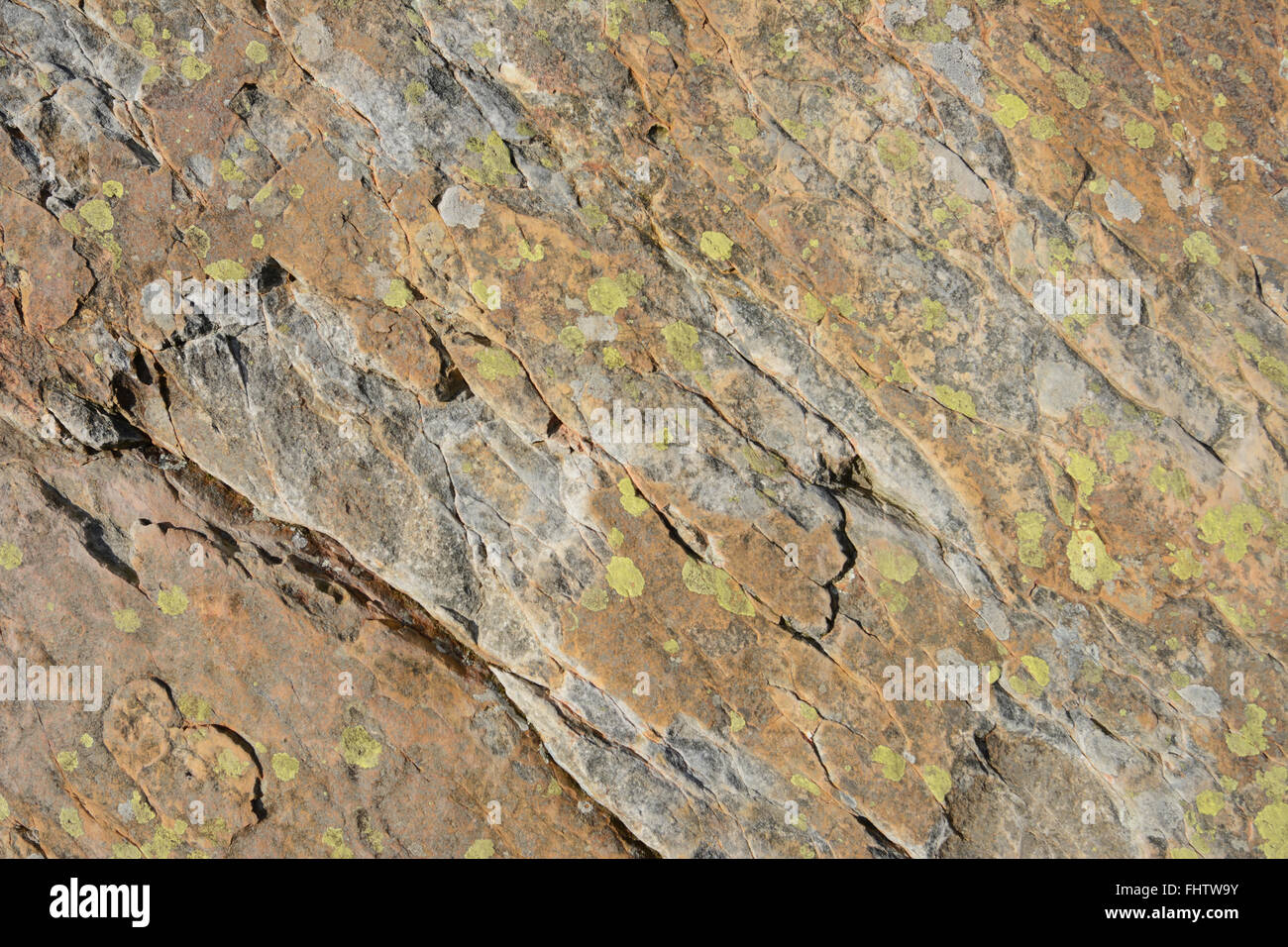 Orange coloured rock texture Stock Photo - Alamy