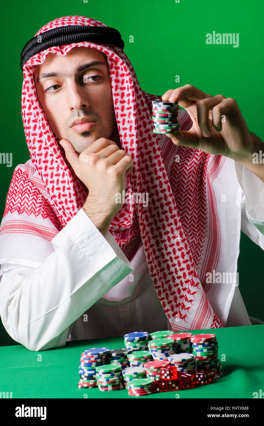 The arab man playing in the casino Stock Photo - Alamy