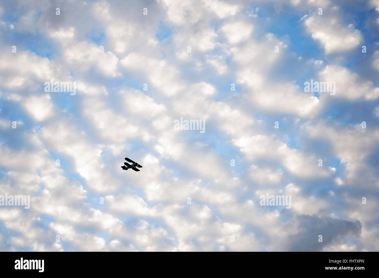 Airplane flying through clouds Stock Photo - Alamy