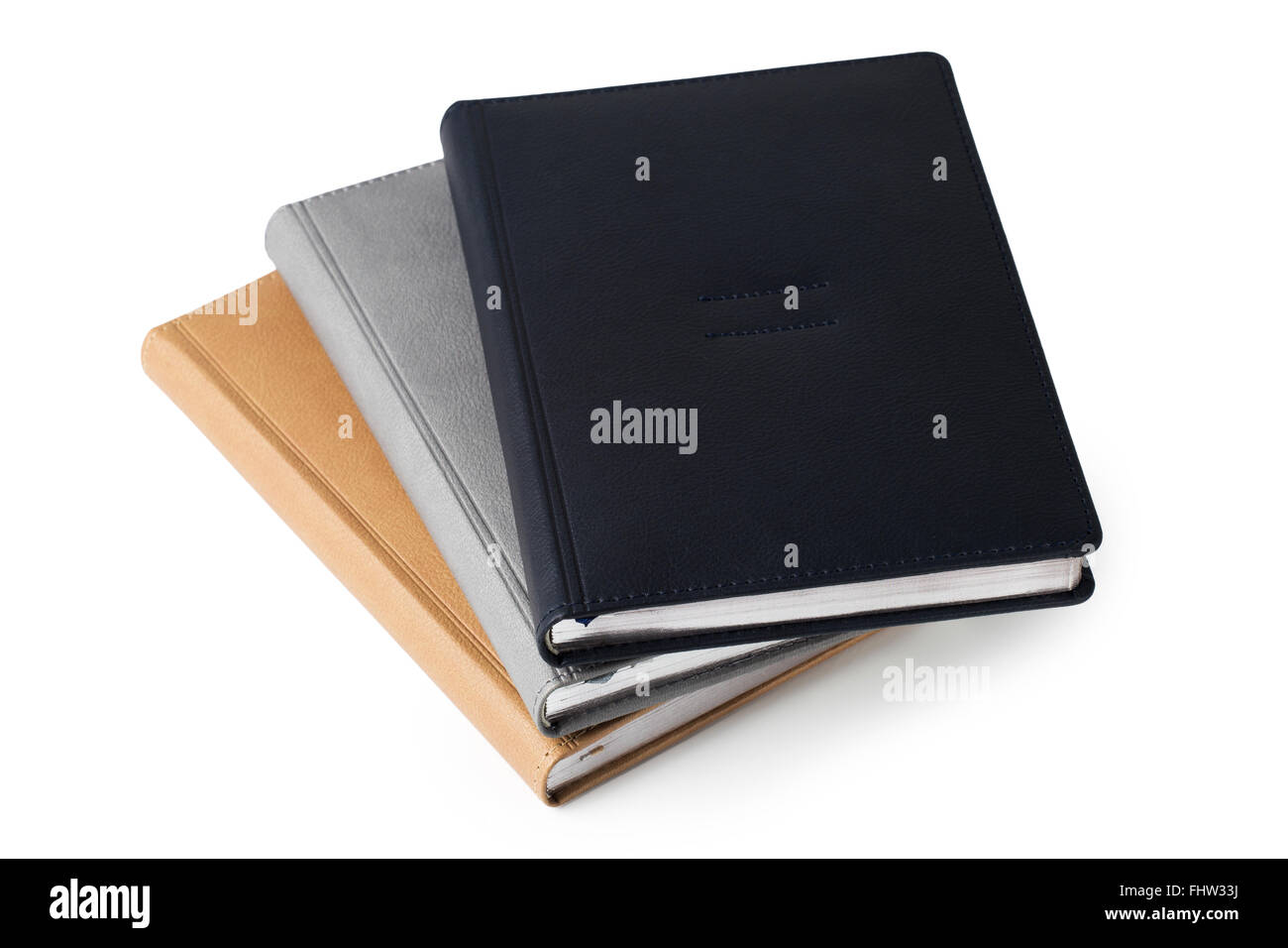 Pile of leather hardcover business diaries isolated on white background ...