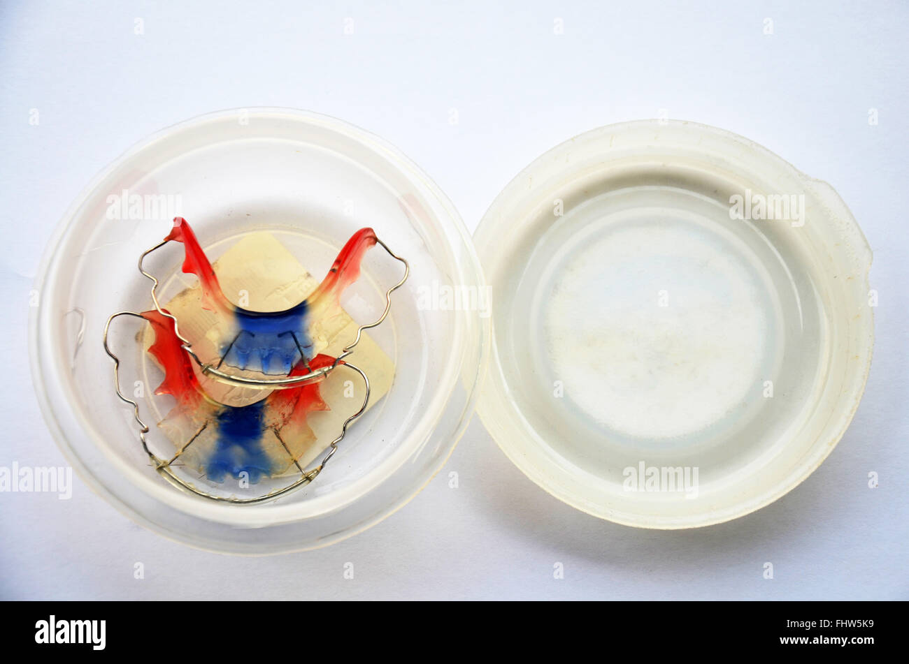 Retainer fashion in white plastic box Stock Photo - Alamy