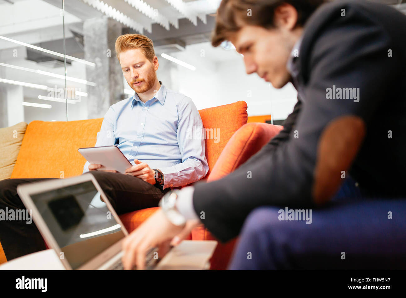 Business colleagues resting and talking during break Stock Photo - Alamy