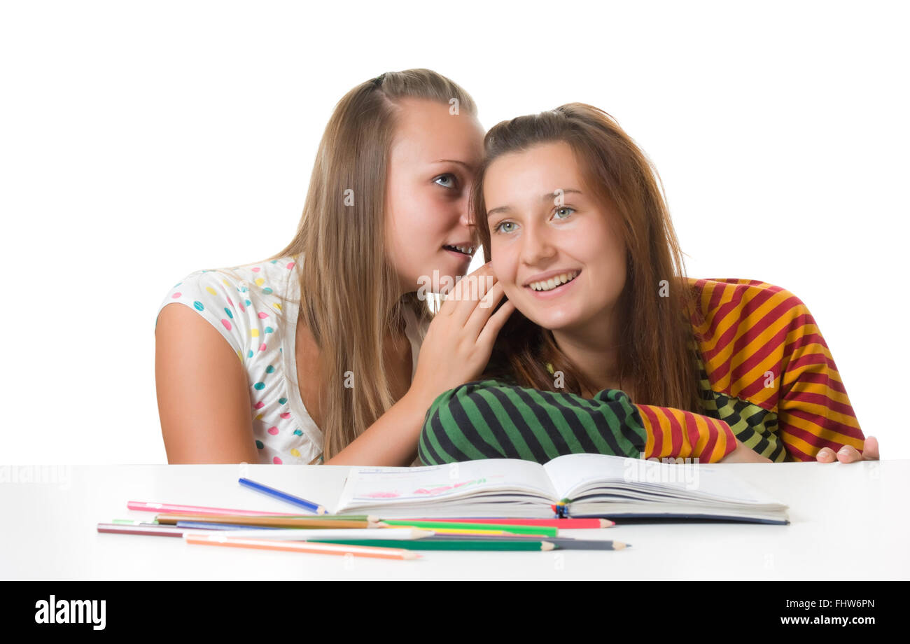 Two teenage girls gossiping Stock Photo - Alamy