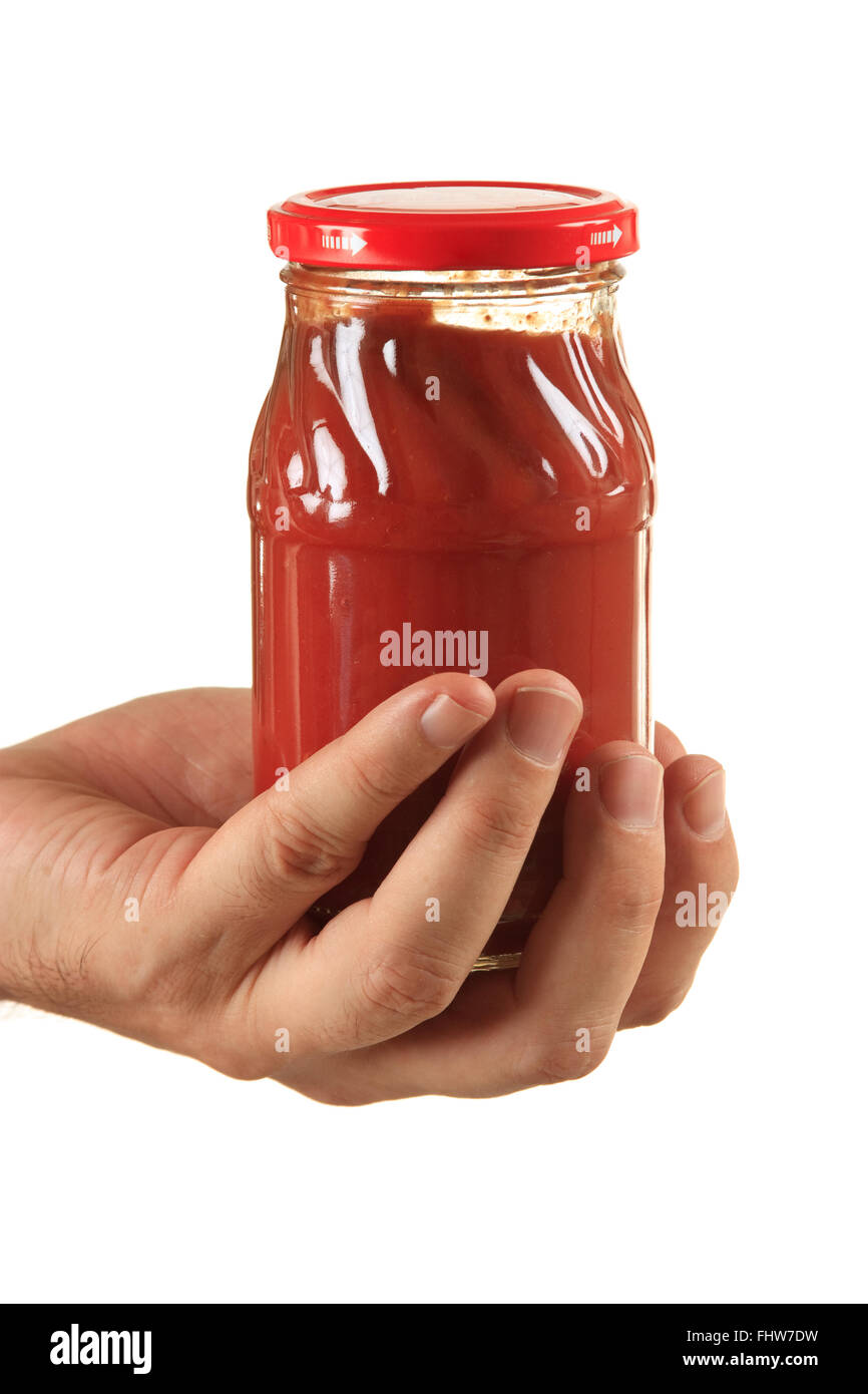 jar tomato paste in hand Stock Photo - Alamy