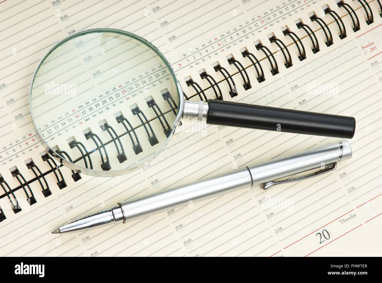 pen and magnifying glass Stock Photo - Alamy