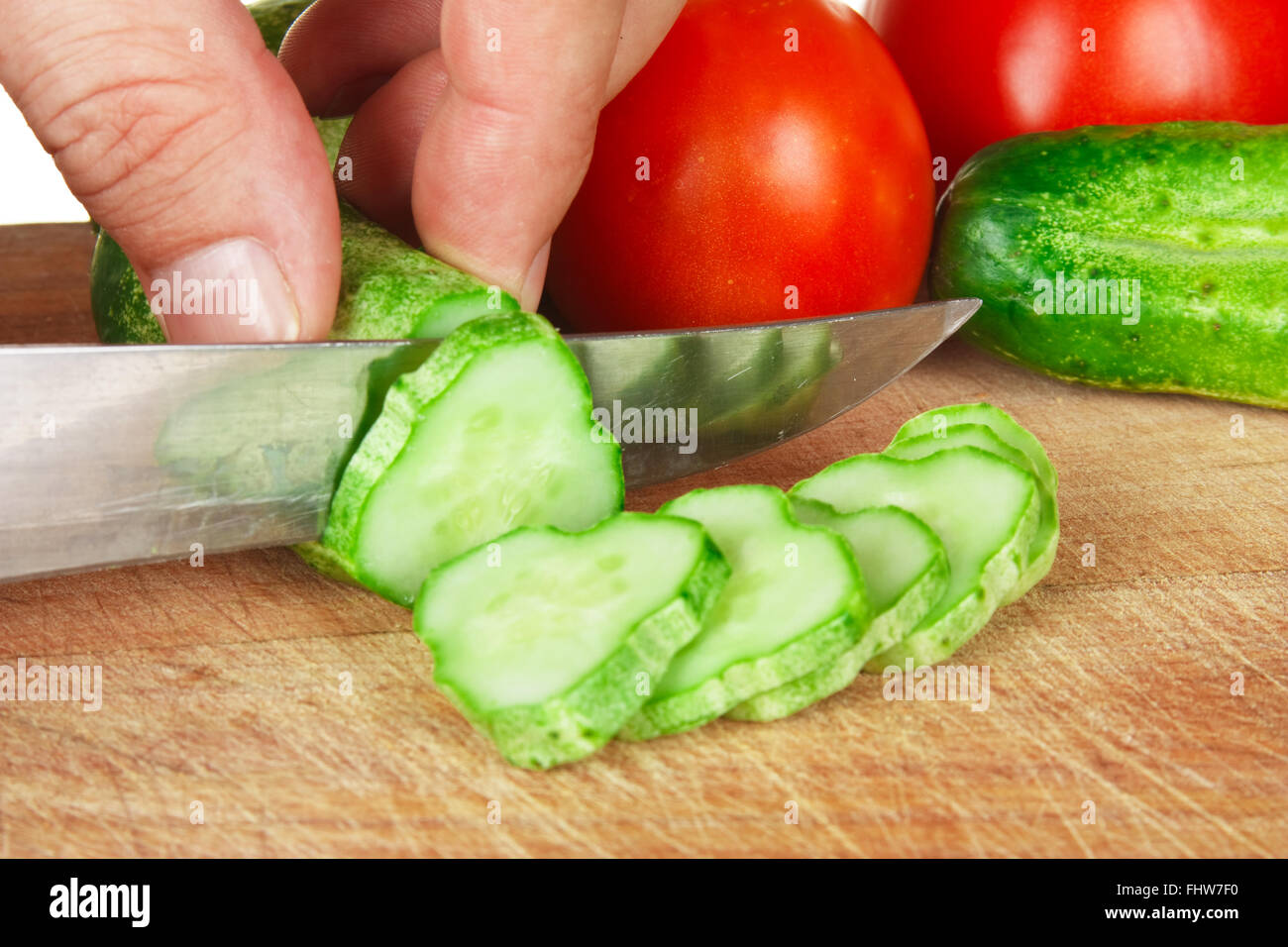 chop tomatoes and cucumbers Stock Photo - Alamy