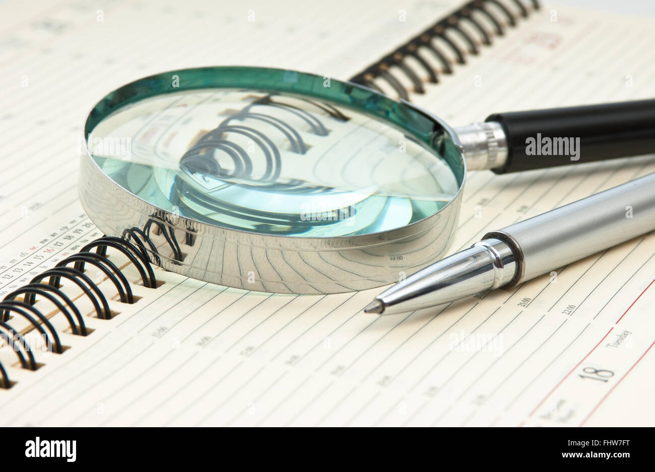 pen and magnifying glass Stock Photo - Alamy