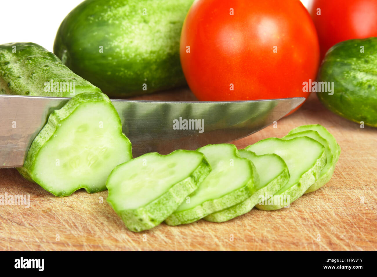 chop tomatoes and cucumbers Stock Photo - Alamy