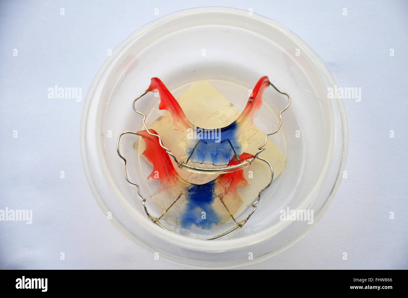 Retainer fashion in white plastic box Stock Photo - Alamy