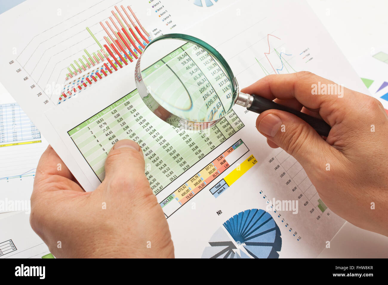magnifying glass in hand and paper Stock Photo - Alamy