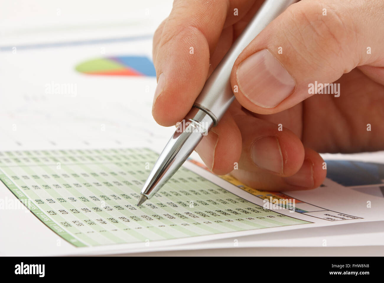 Male’s hand writing in the document Stock Photo - Alamy