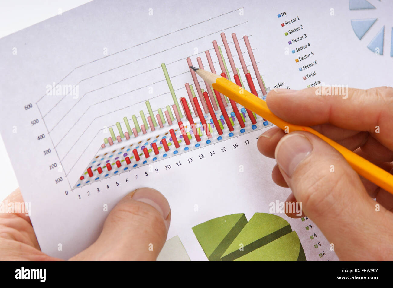 pencil in hand and working paper Stock Photo - Alamy