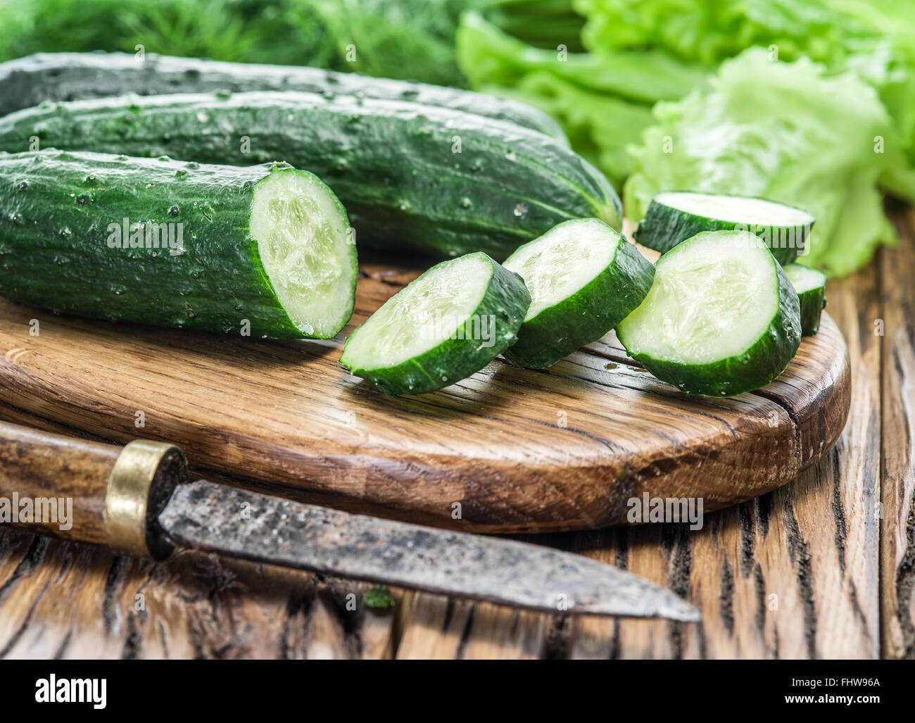 Cucumbers on the wooden table Stock Photo - Alamy