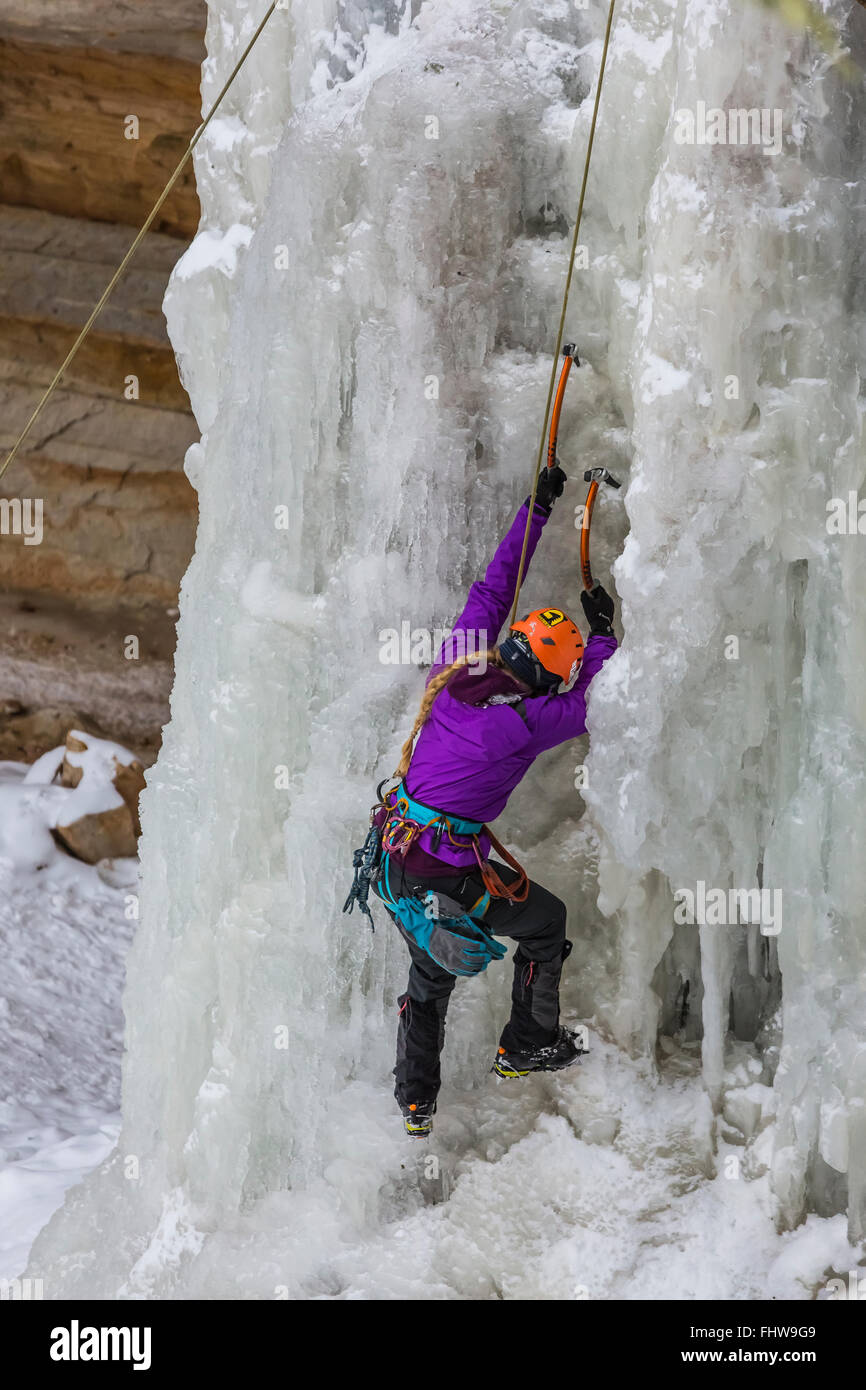 Ice climber at a frozen waterfall hi-res stock photography and images ...