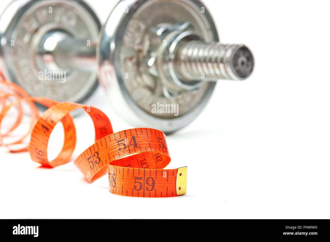 dumbbell and measuring tape Stock Photo - Alamy