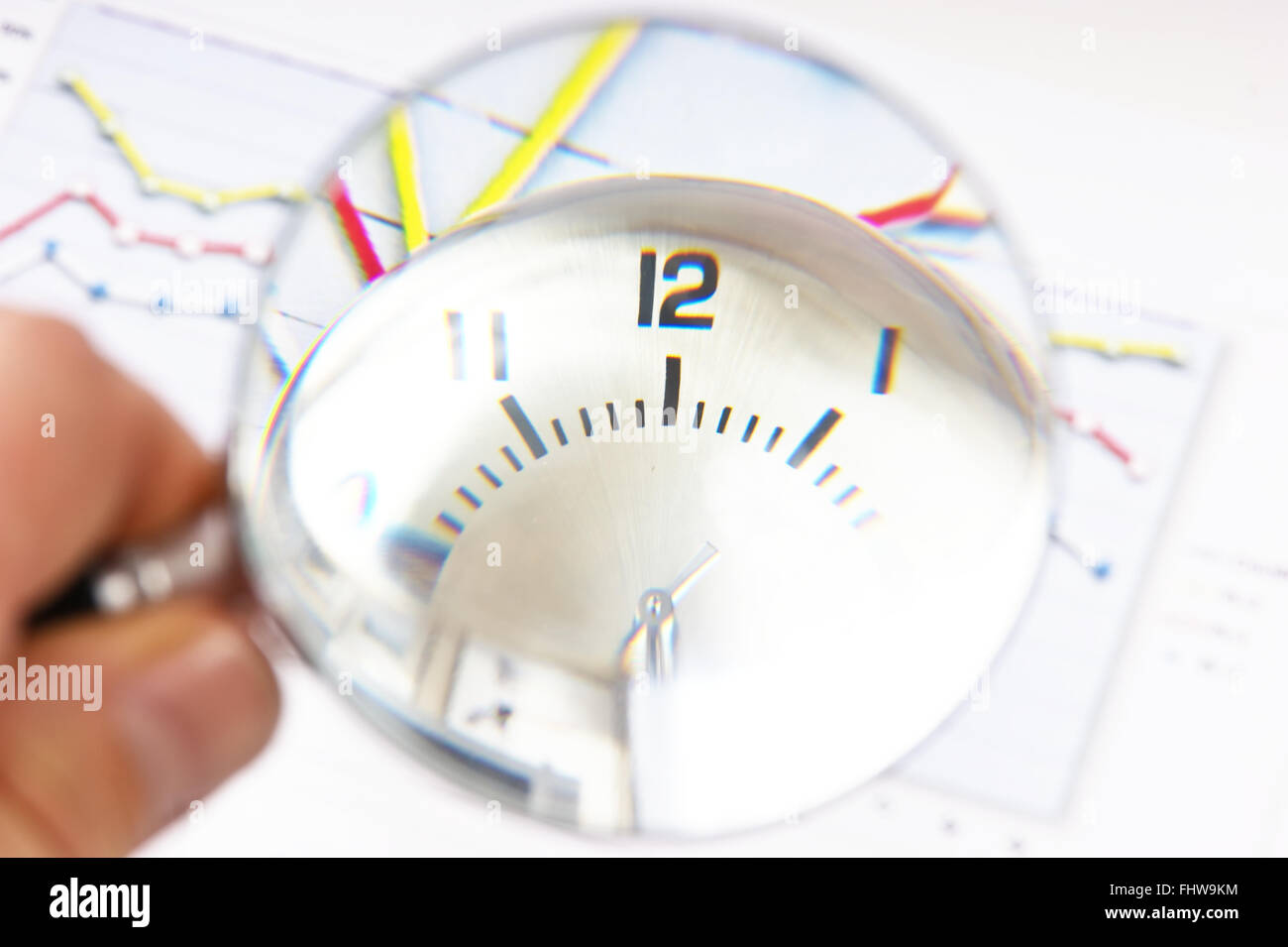 magnifying glass and watch Stock Photo - Alamy