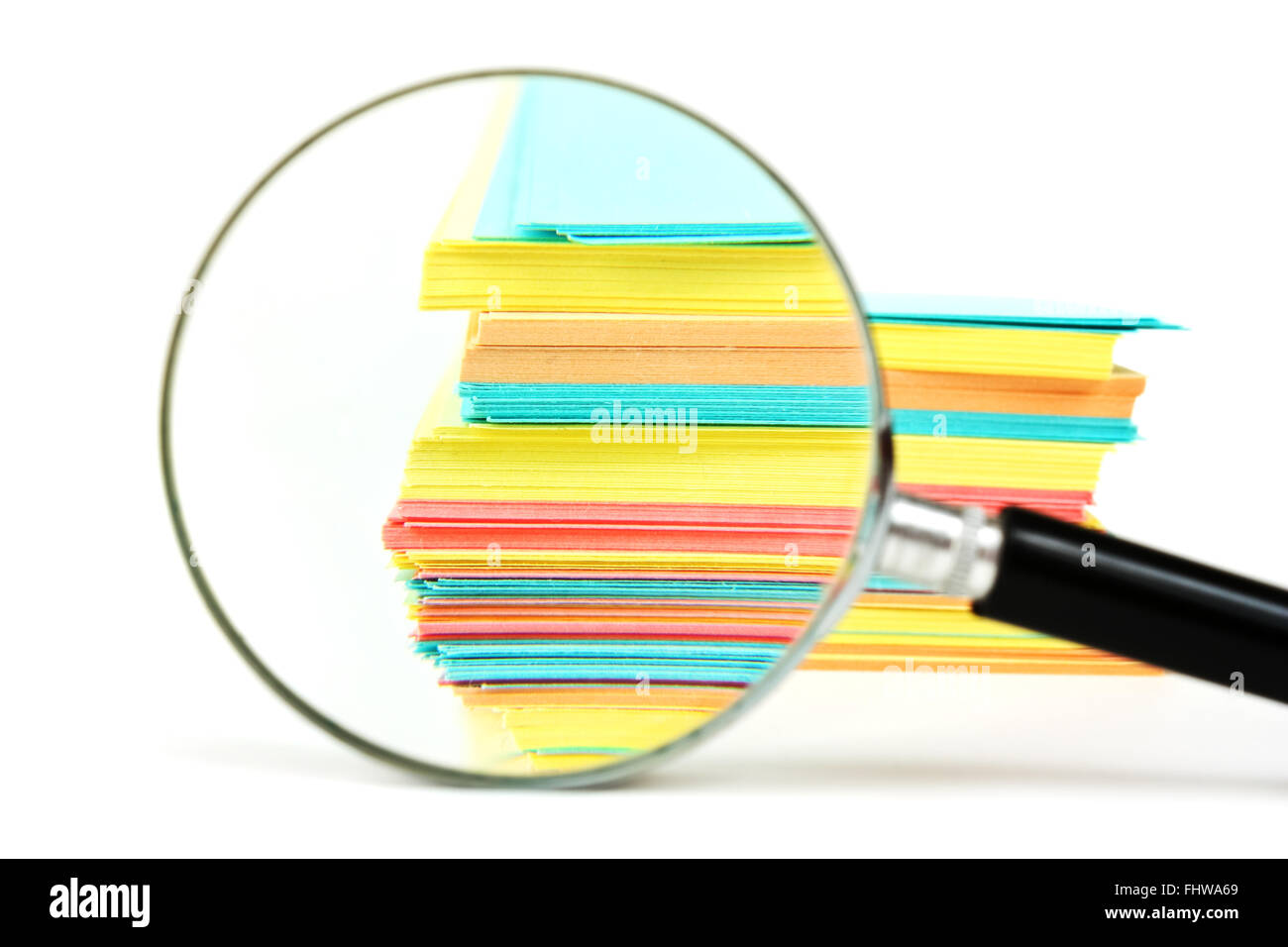 magnifying glass and a stack of paper Stock Photo - Alamy