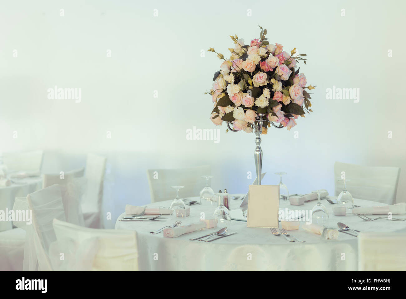 Beautiful decoration on wedding table with roses in bouquet Stock Photo ...