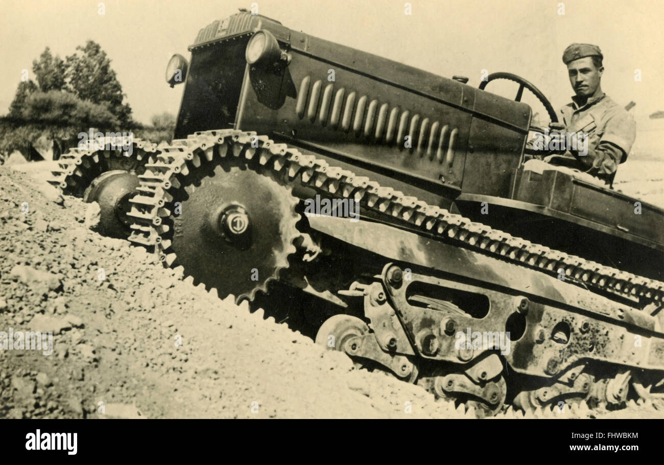 A soldier at the wheel of a tractor, Italy Stock Photo - Alamy