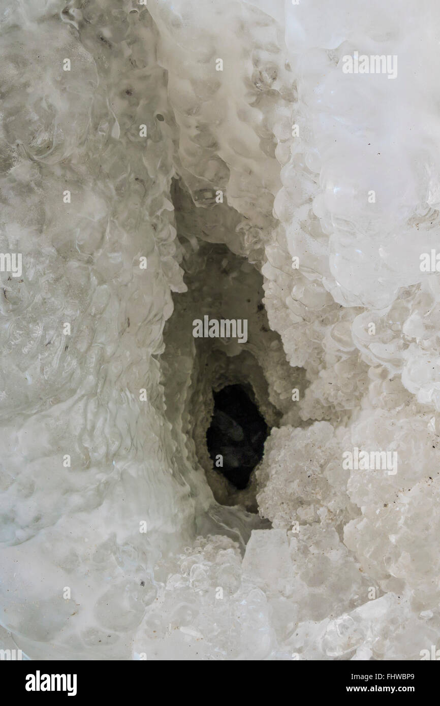 Hole created by dripping water, No Boundaries ice formation at Sand ...