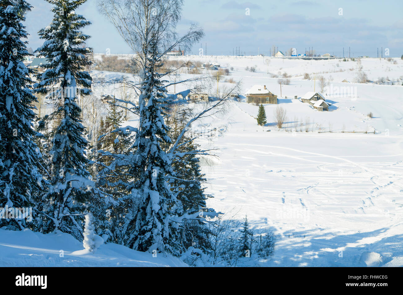 landscape of the Russian village in a taiga in Sibirea in the winter,a ...