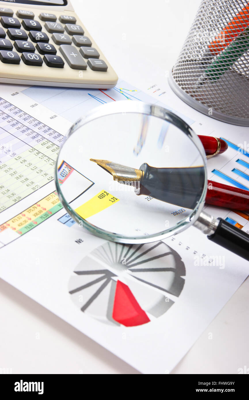 magnifying glass and the working paper Stock Photo - Alamy