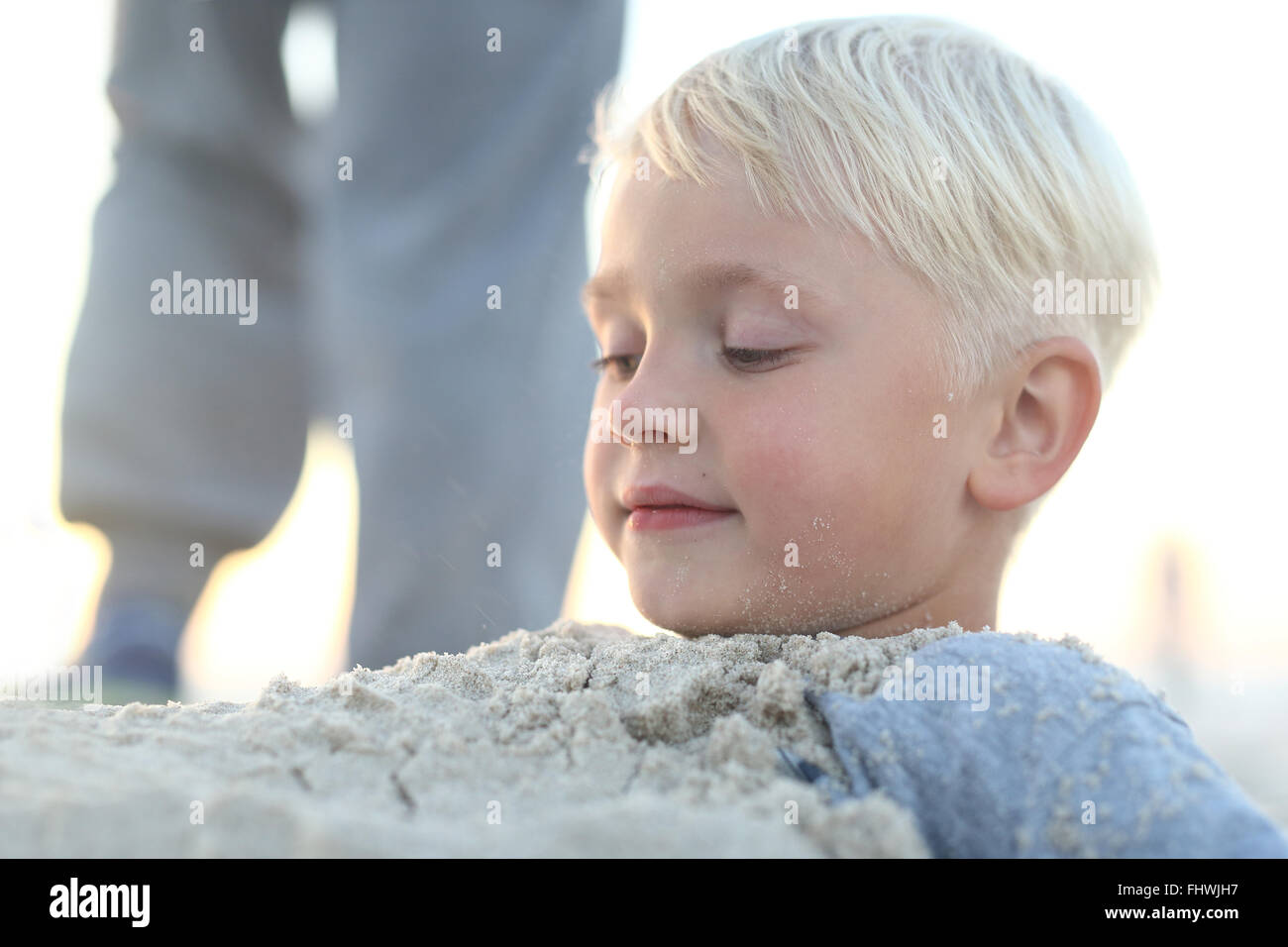 Buried sand fun hi-res stock photography and images - Alamy