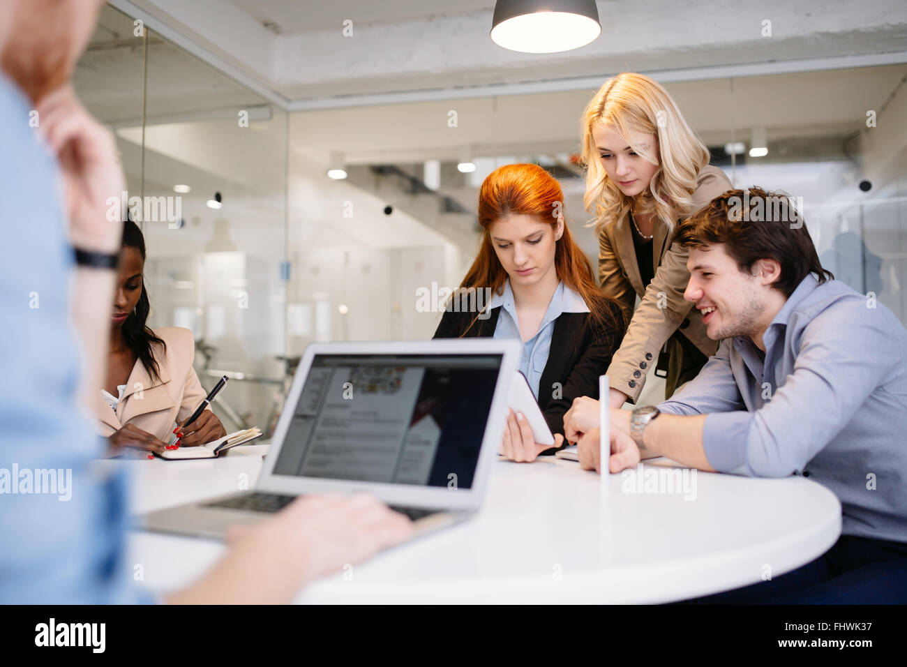 Businesspeople working in office and sharing ideas Stock Photo - Alamy