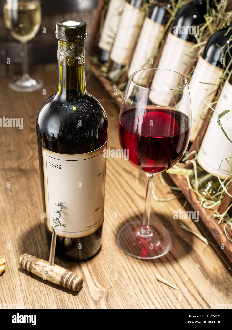 Glass of wine and wine bottle. Wine testing at the storage Stock Photo ...