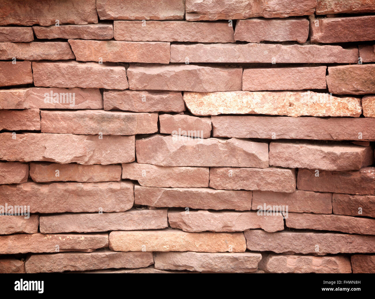 Elegant stone wall from small square parts Stock Photo - Alamy