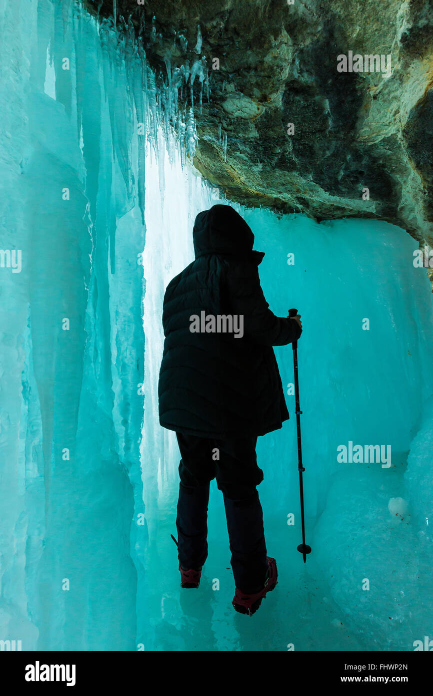 Hiker with translucent ice in The Curtains ice formation, Pictured ...